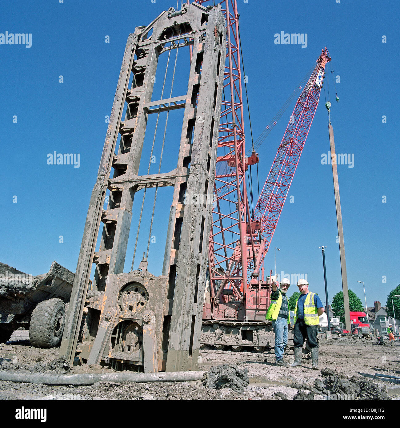 Contractor using a clamshell-type excavator mounted onto a crawler ...