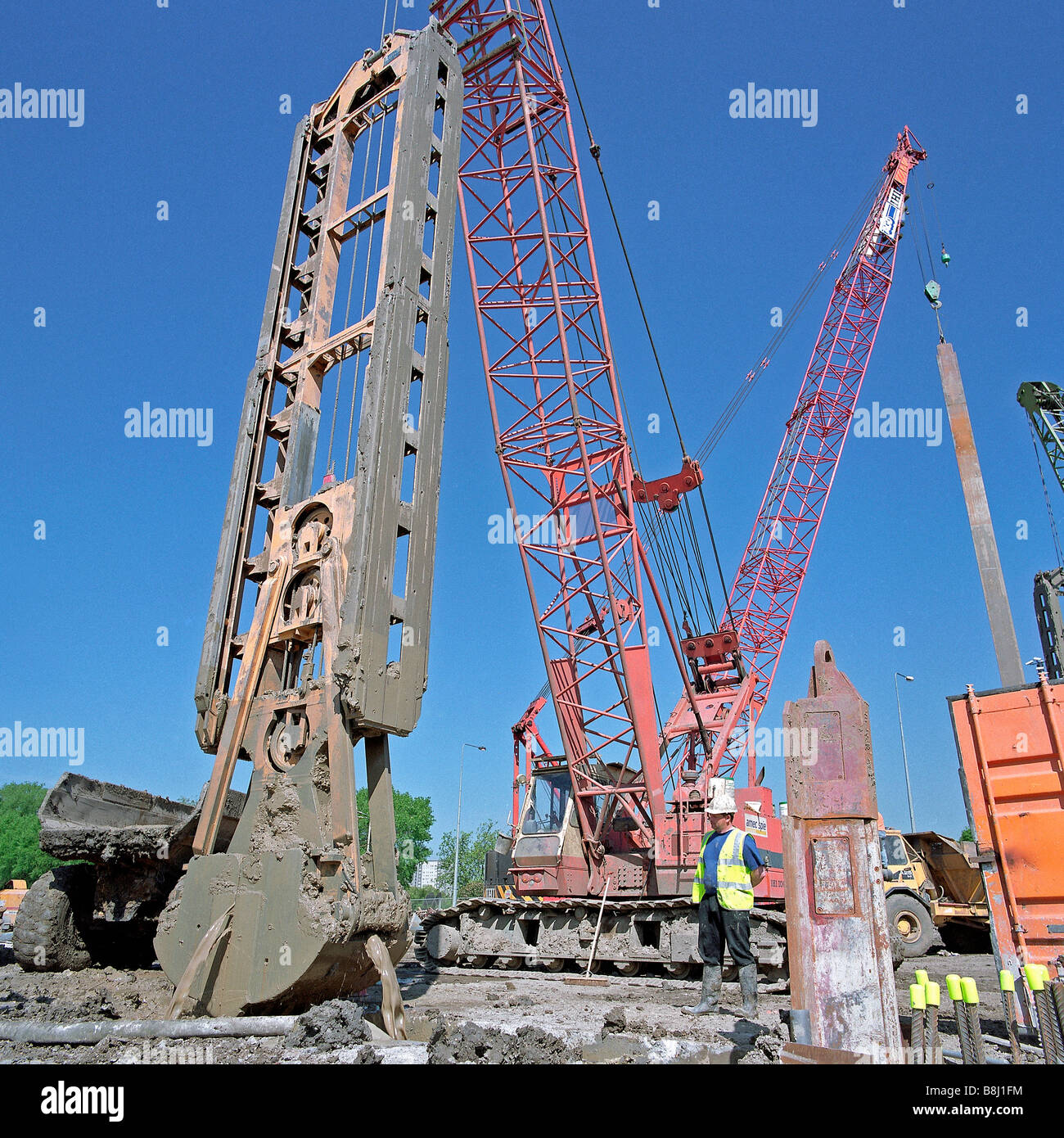 Contractor using a clamshell-type excavator mounted onto a crawler ...