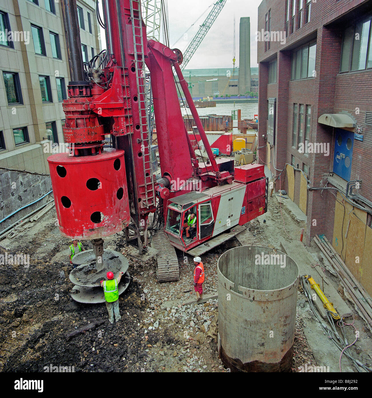 Rorary boring rig working in a confined city location excavating ...