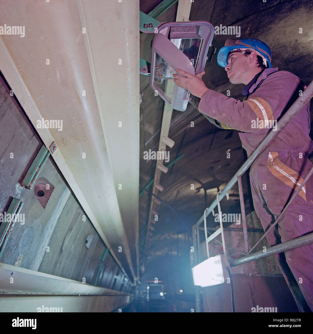 French engineer on special works train installing one of 20,000 light ...