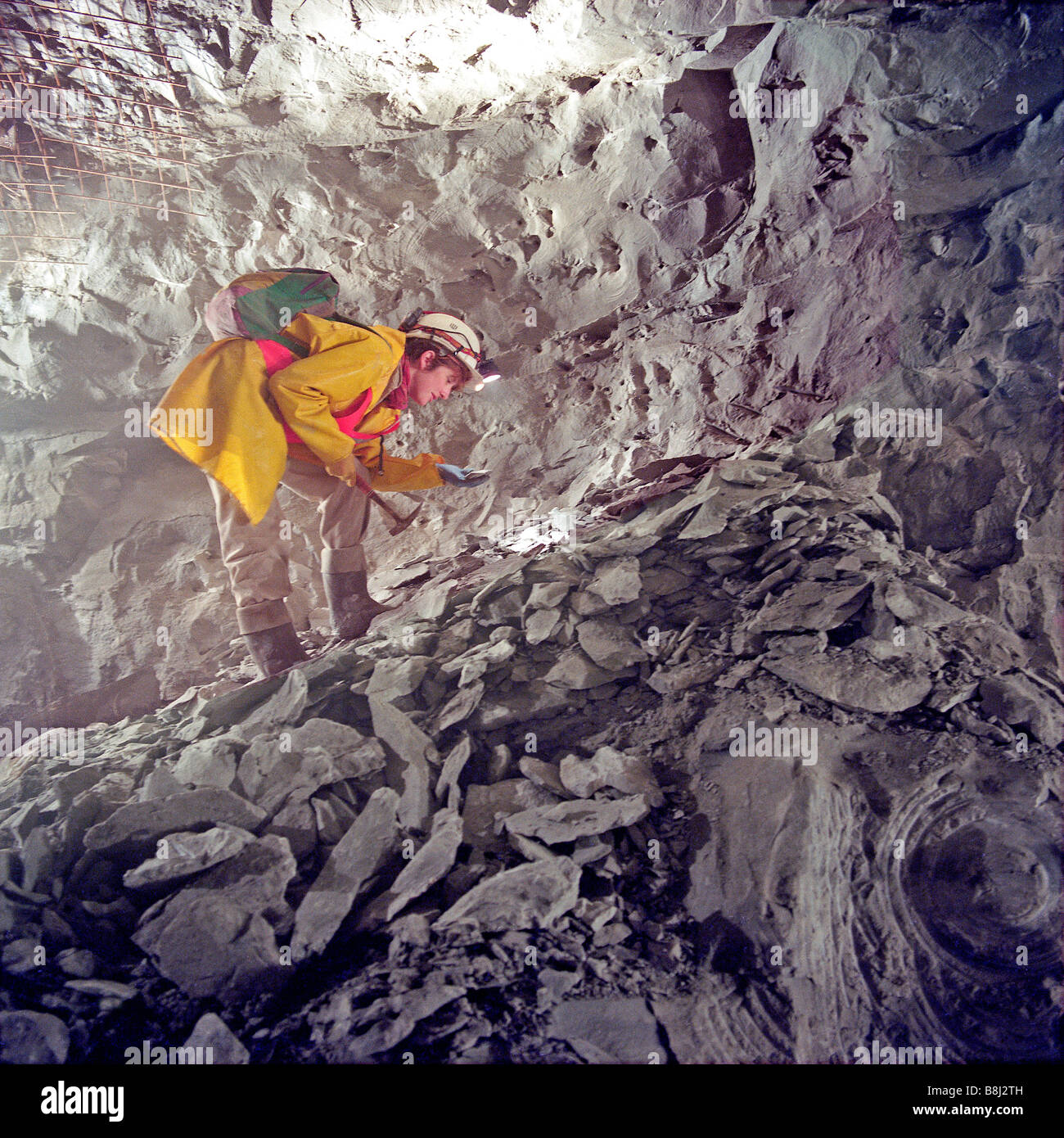 French geologist examining rock samples during the construction of the ...