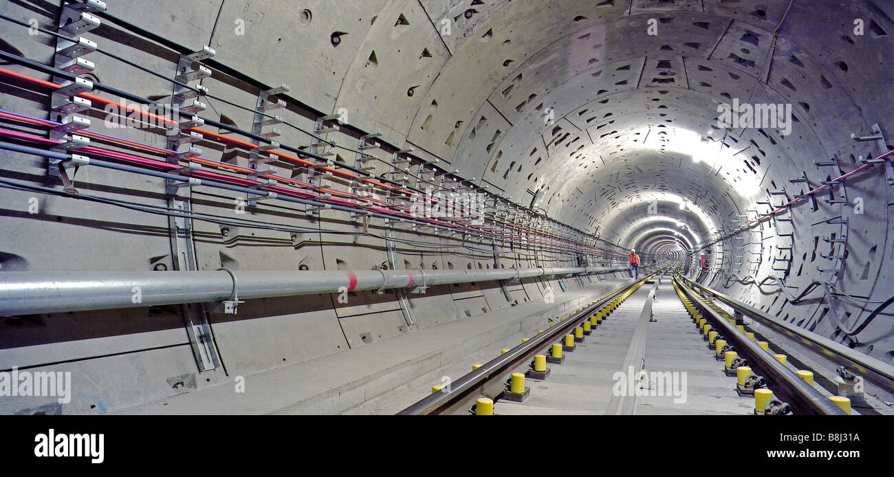 Engineer inspecting newly laid trackwork in a Jubilee Line Extension ...