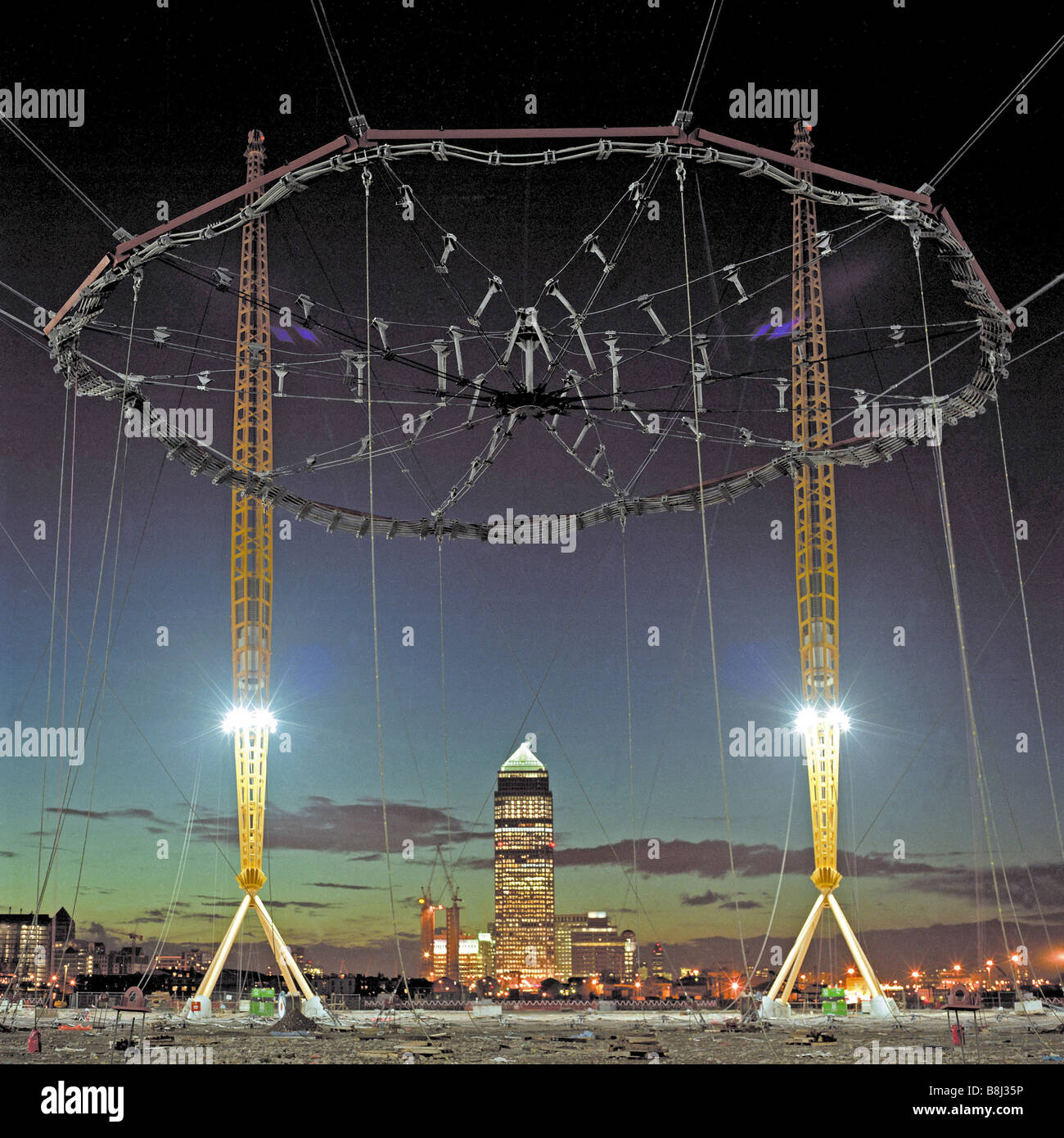 Like a giant spider's web, the cable net structure is raised during ...