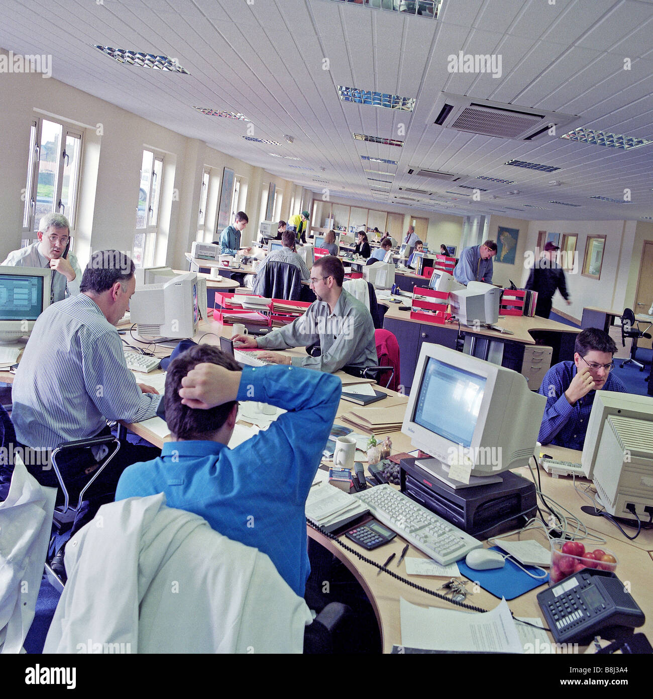Busy open-plan office space which may result in increased stress levels ...