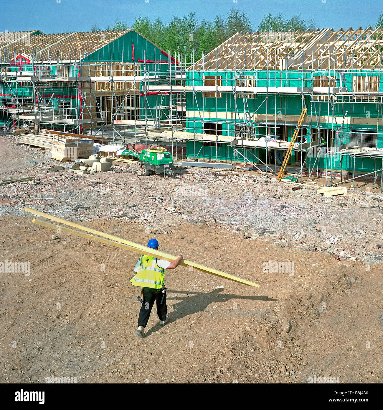 Contractors assembling timber-framed structures - a fast, economical ...