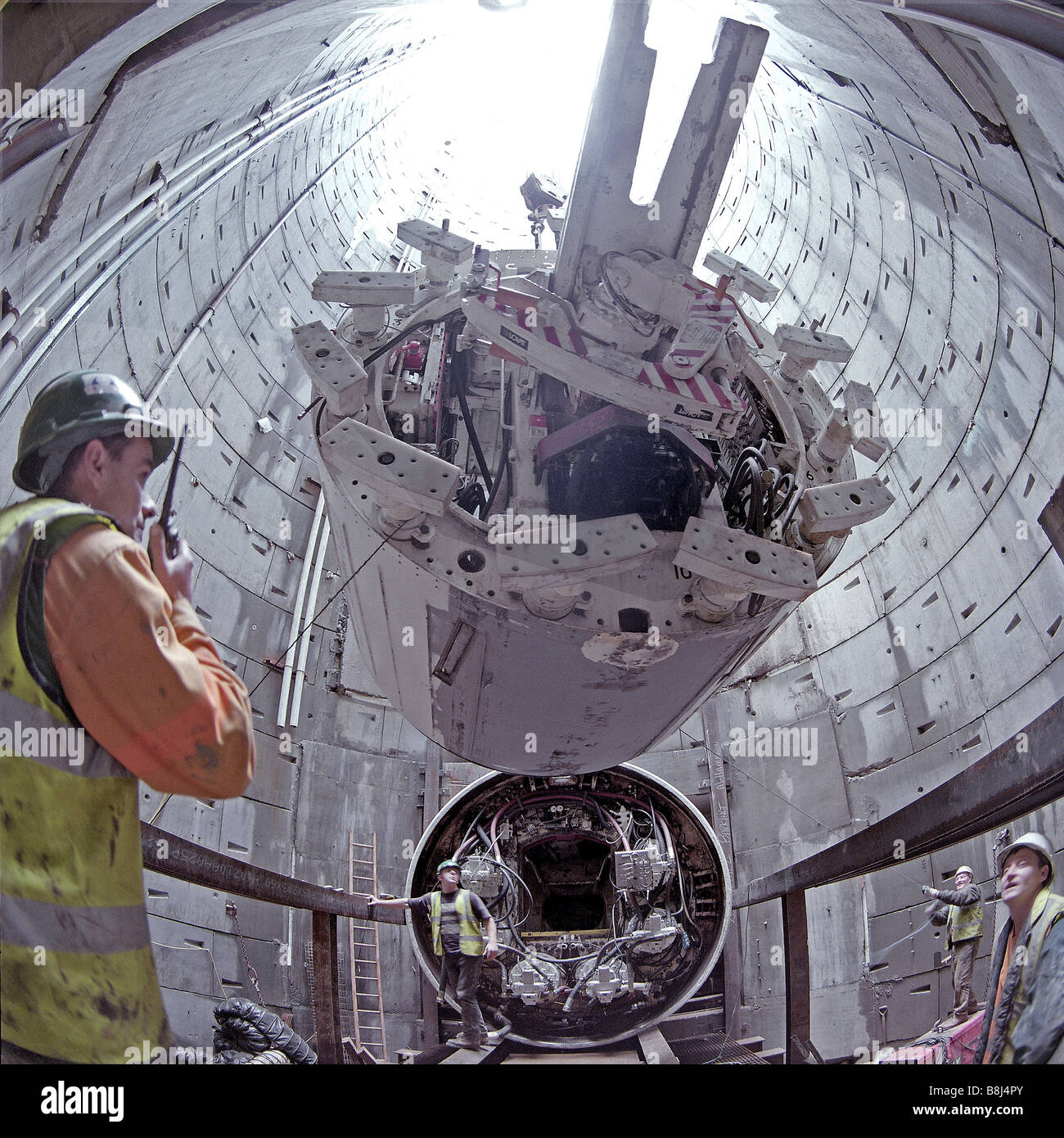 Contractors lowering tunnel boring machine, which will excavate power ...