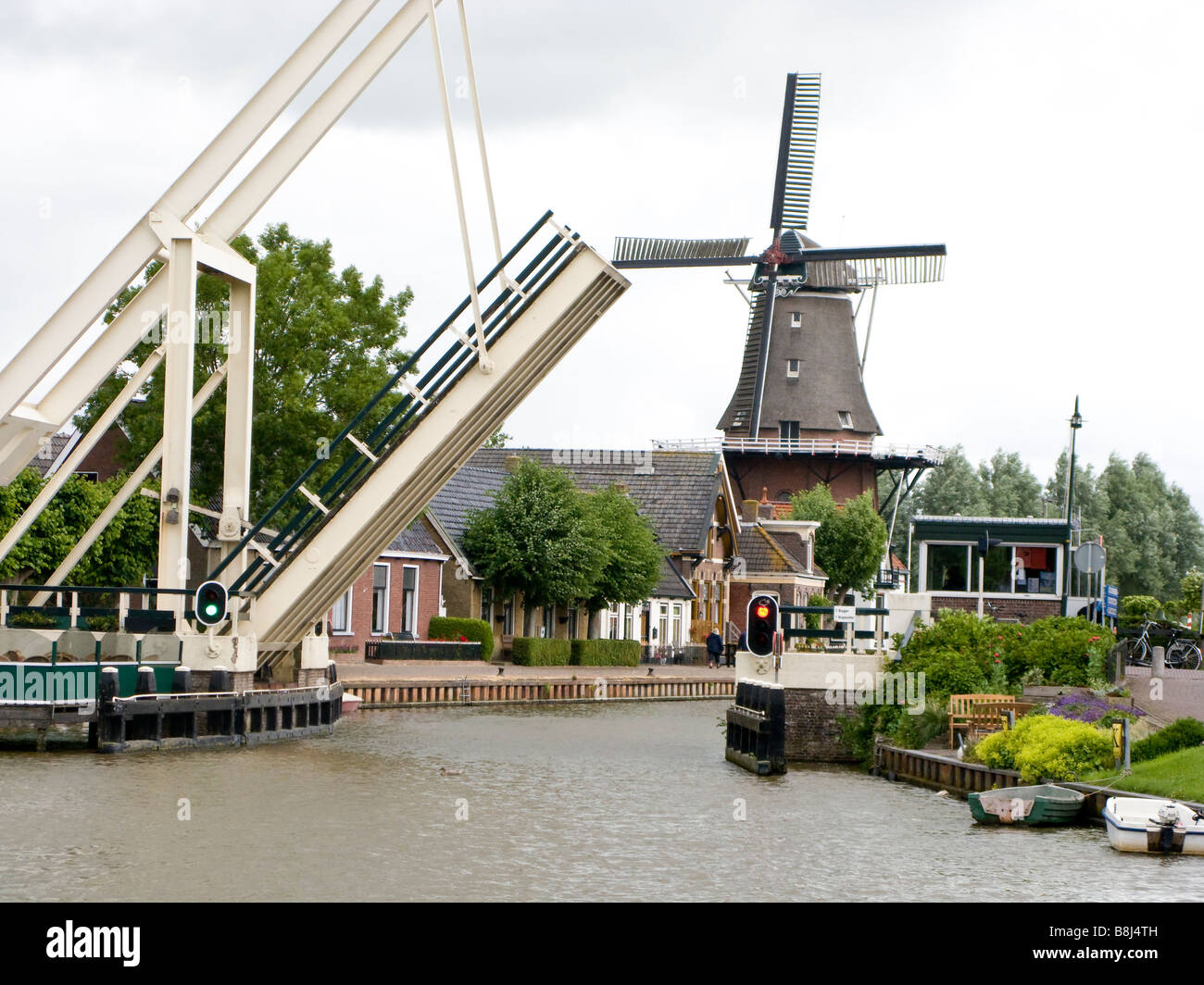Old Windmill in Princess Margaret Canal, Friesland Stock Photo - Alamy