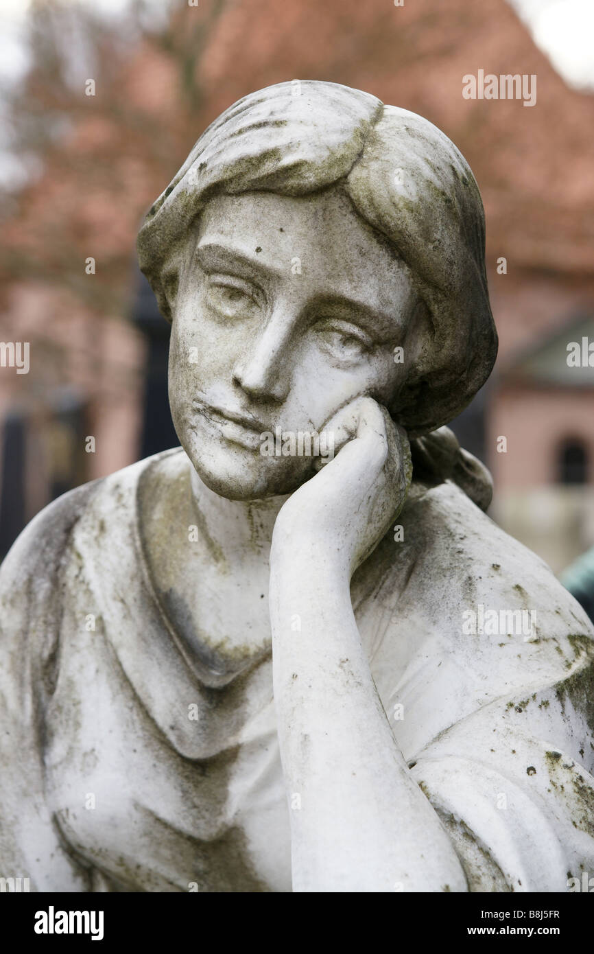 Ancient female sculpture at a gravestone in a grave yard Stock Photo ...
