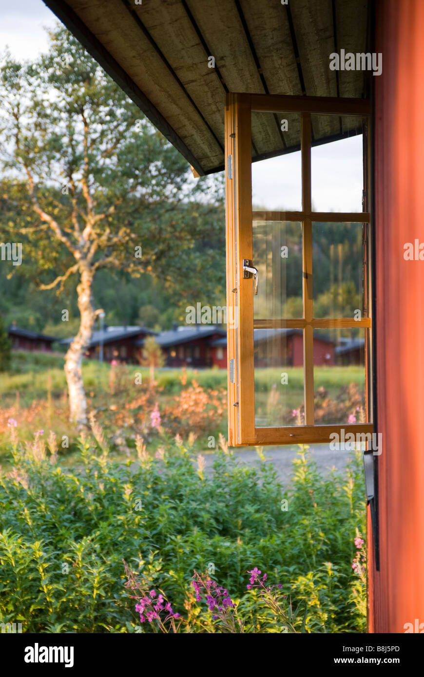 Window open on a red cottage Stock Photo - Alamy