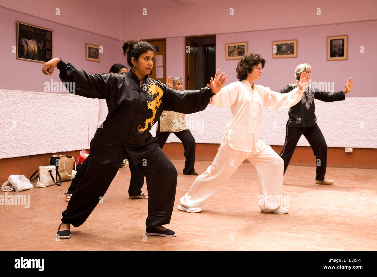 Women participate in a Tai Chi demonstration. They are members of a Tai ...