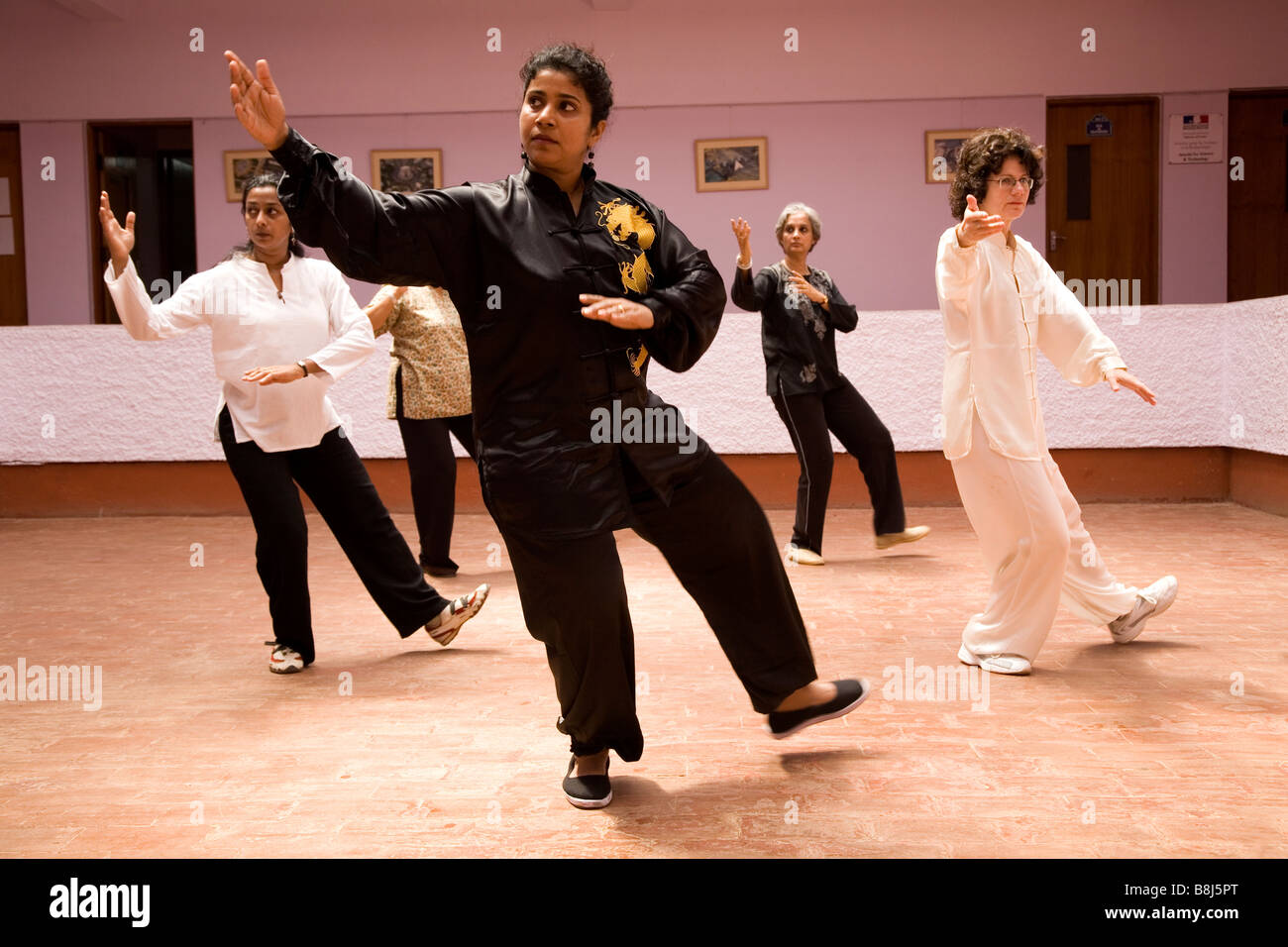 Women participate in a Tai Chi demonstration. They are members of a Tai ...