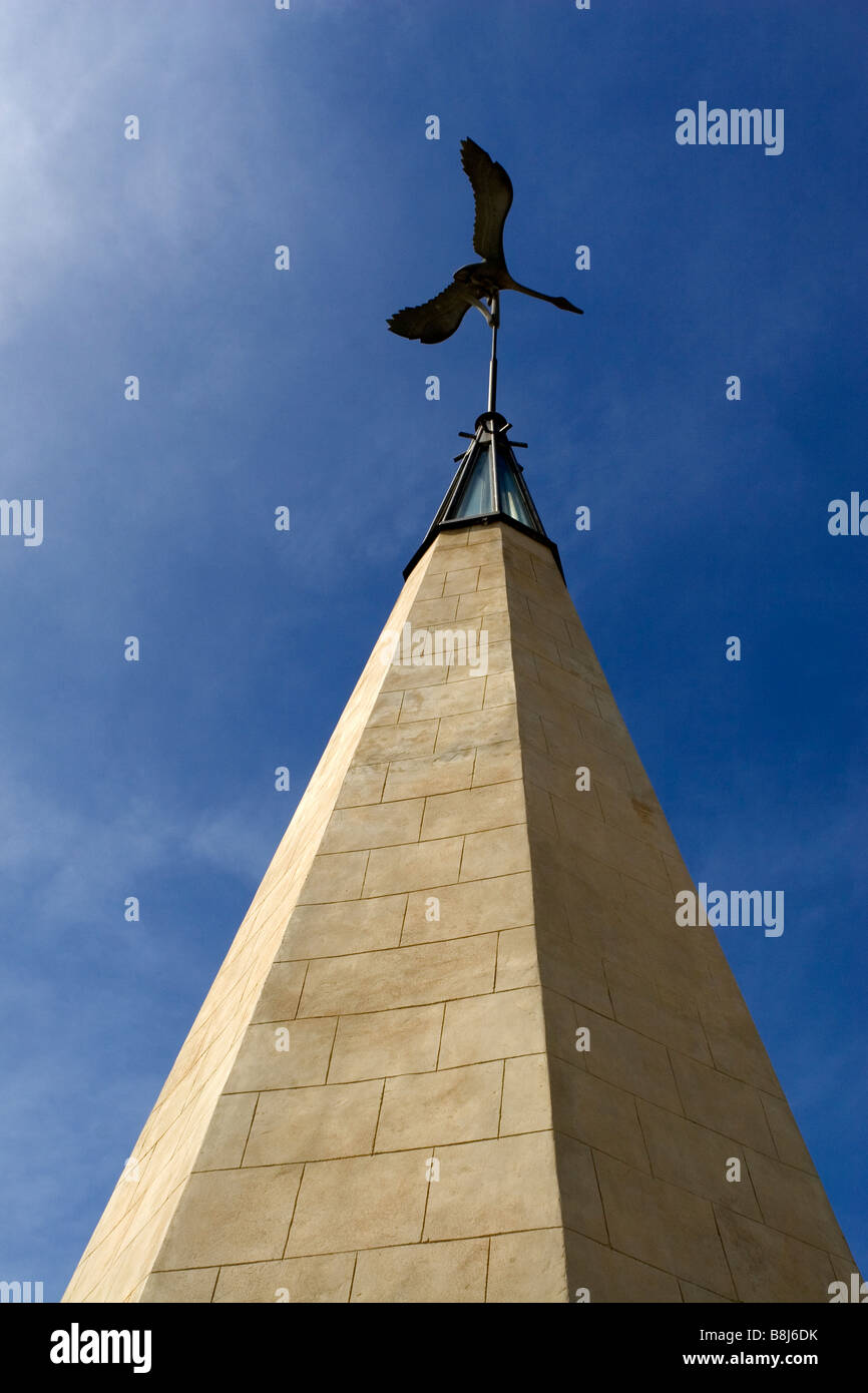 A stone monument is capped by the statue of a bird in Palma, Mallorca ...