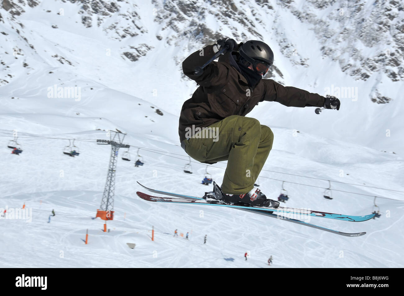 a girl skier during a high jump in a crouched position Stock Photo - Alamy