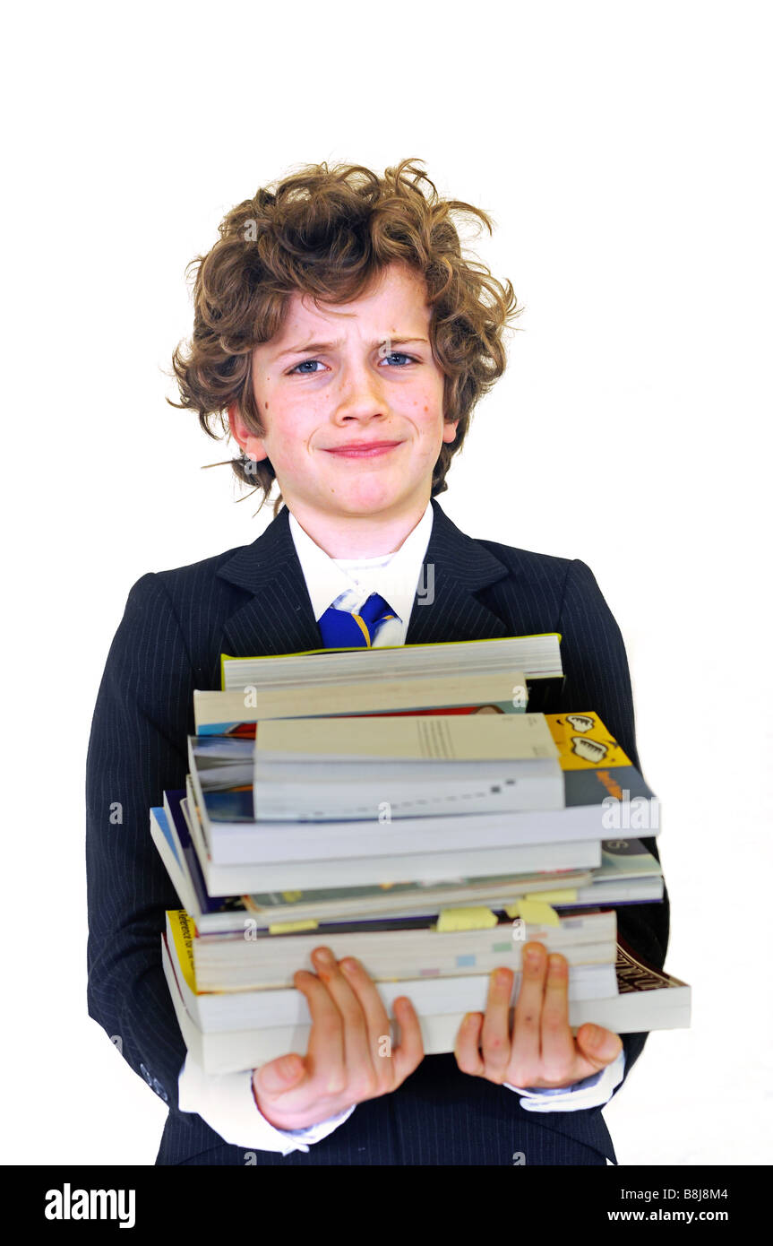 school boy carrying pile of books Stock Photo - Alamy