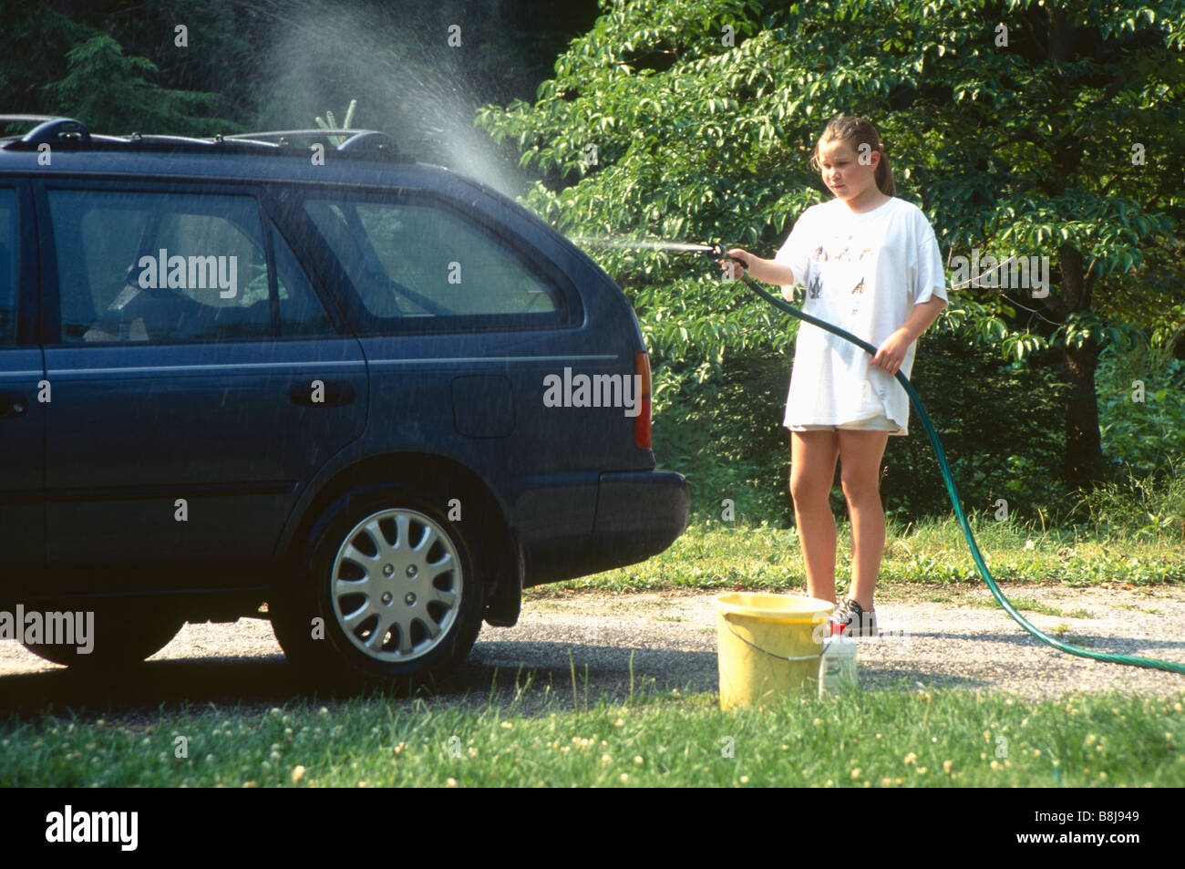 Teenager washing car hi-res stock photography and images - Alamy