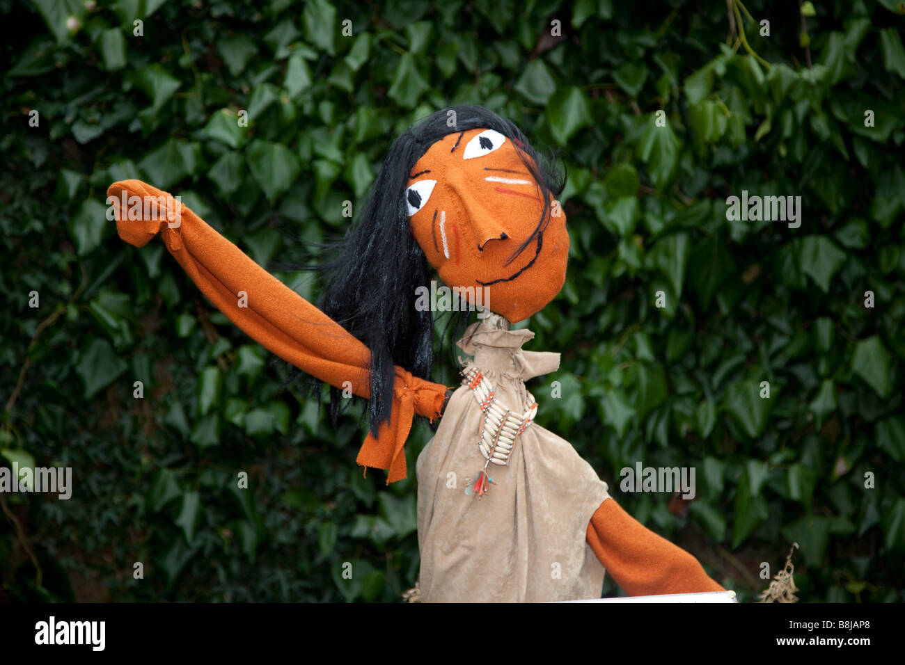 Orange Native american indian figure at the Scarecrow festival event ...