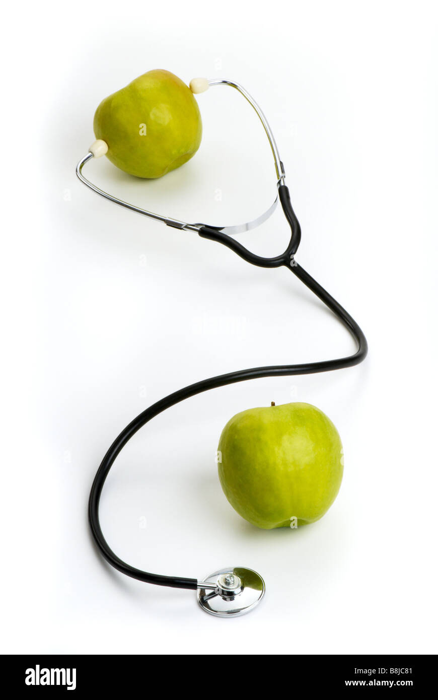 Apple-doctor with a stethoscope and apple-patient Stock Photo - Alamy