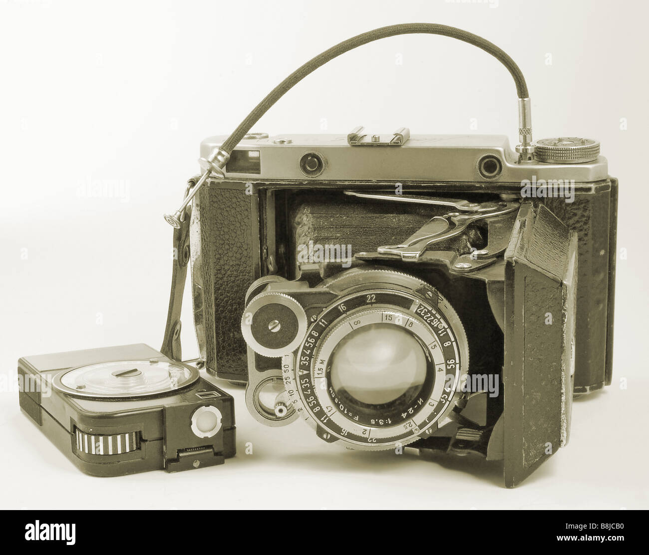 The antiquarian average format camera with light meter Stock Photo - Alamy
