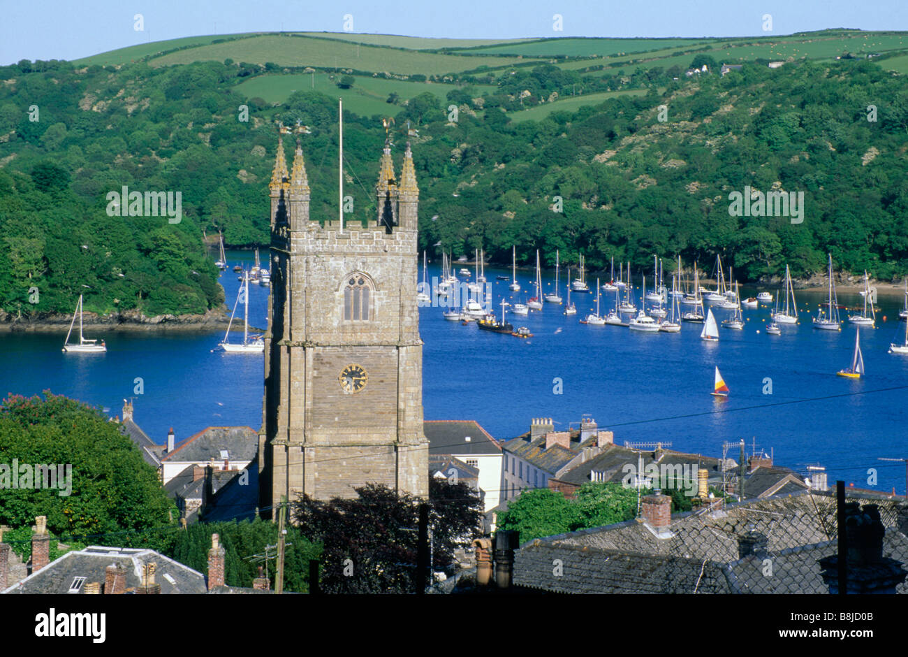 Fowey church village and estuary Small boats Trees and hills FOWEY ...