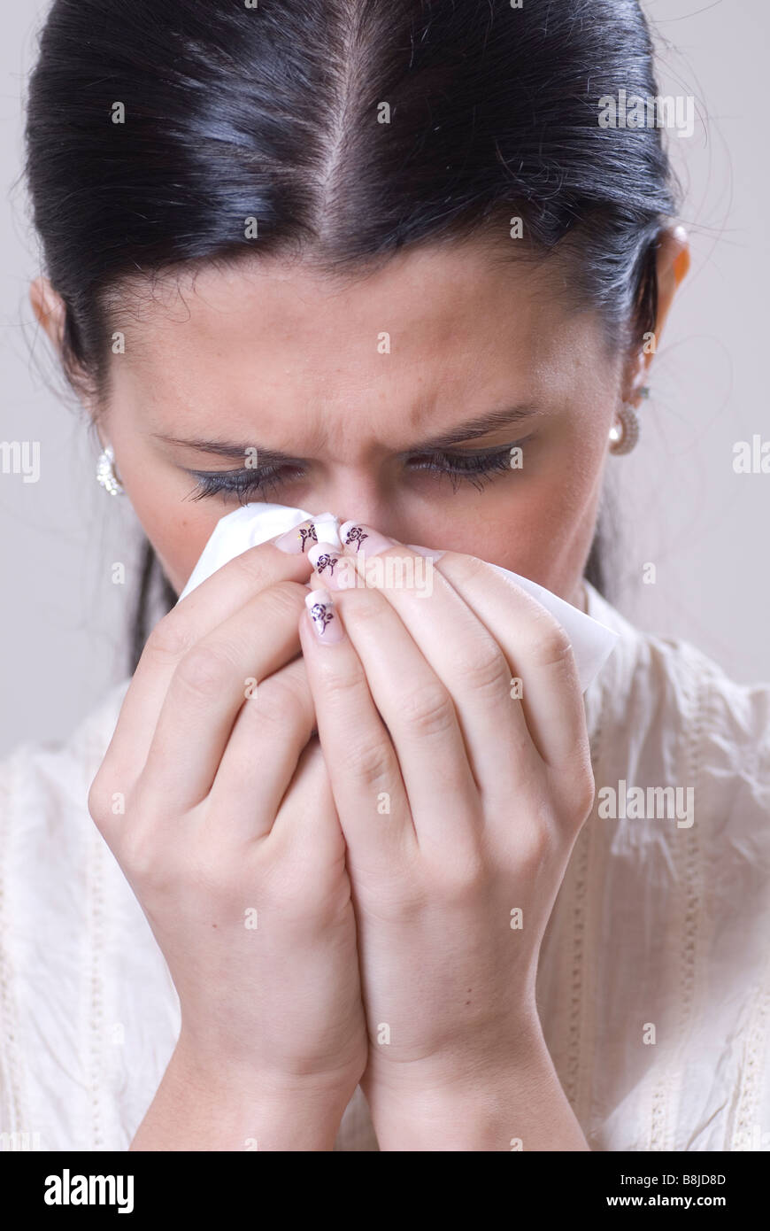 Woman crying and wiping tears with tissue Stock Photo - Alamy