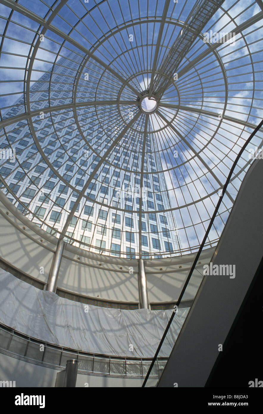 Docklands light railway station roof and Canary Wharf building in ...