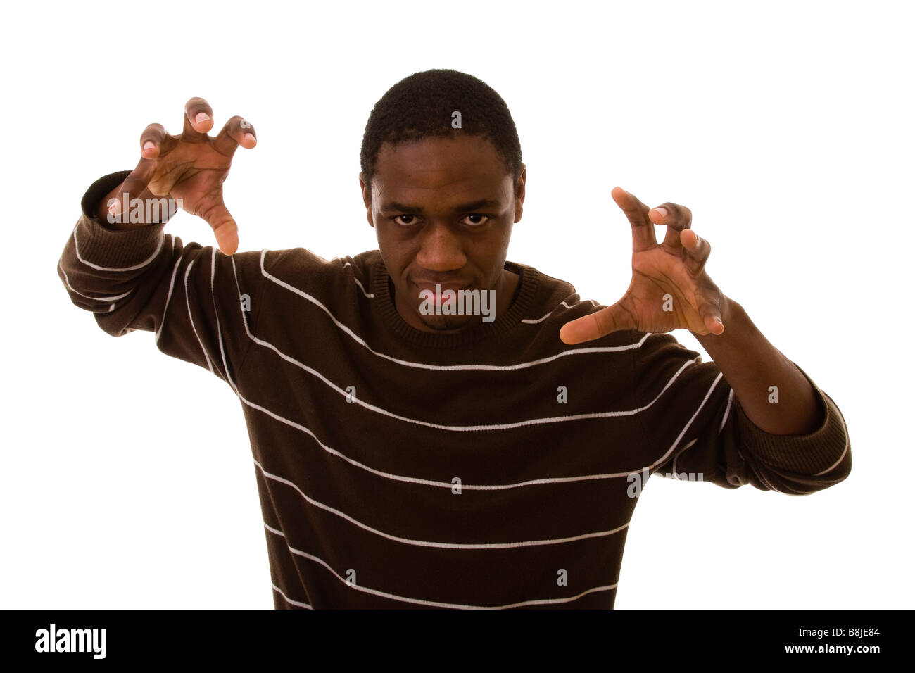 mad african young man attacking with his hands isolated on white Stock ...