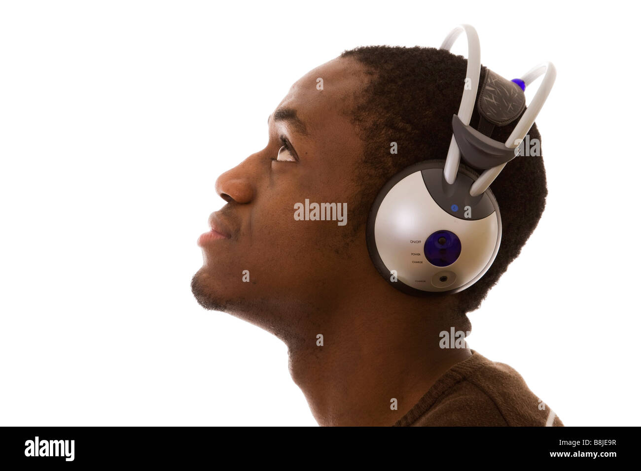 african young men enjoying some music in the headphones isolated on ...