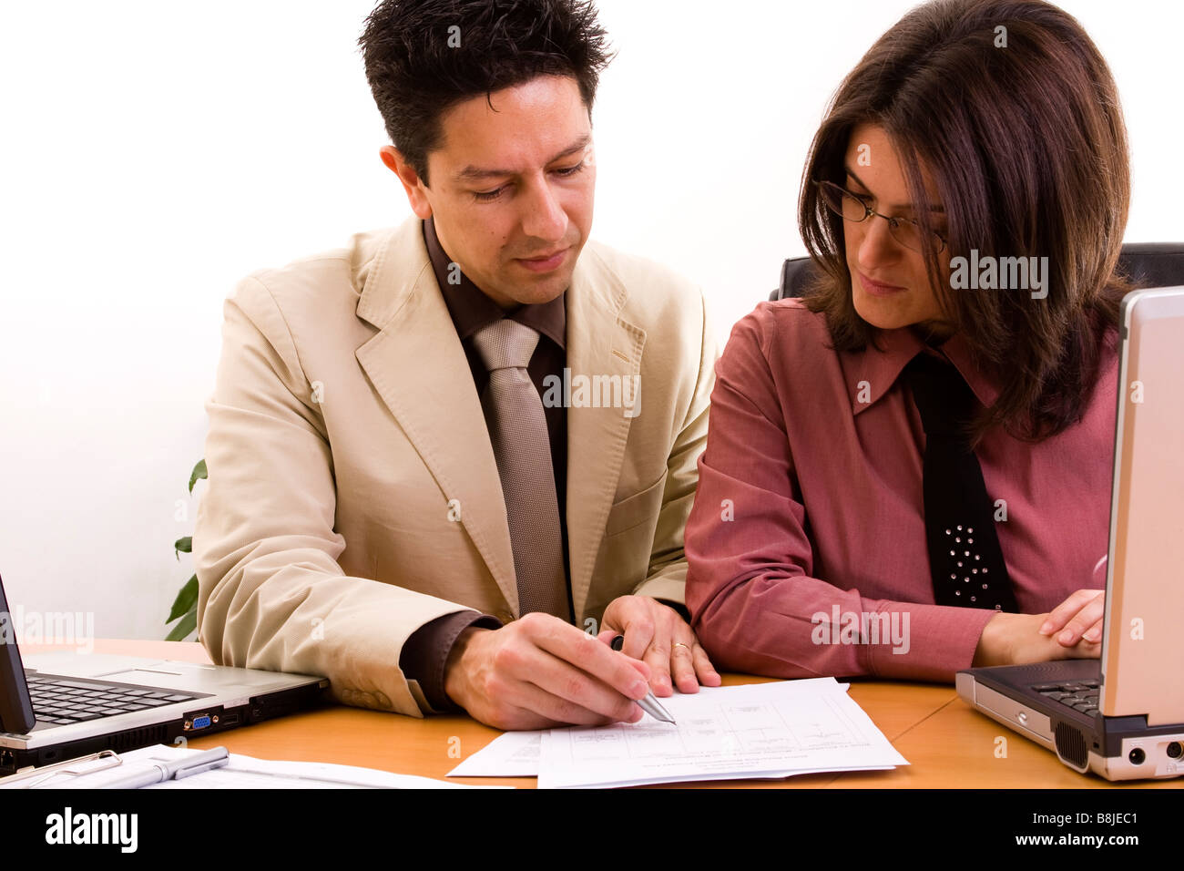 business team reviewing some documents at the office Stock Photo - Alamy