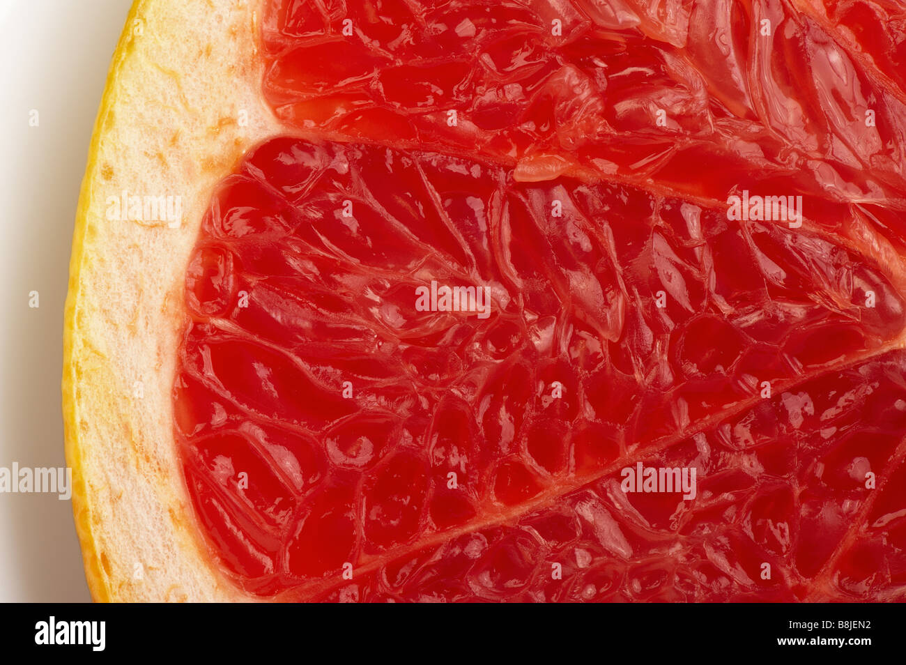 The cut of red grapefruit. Macro Stock Photo - Alamy
