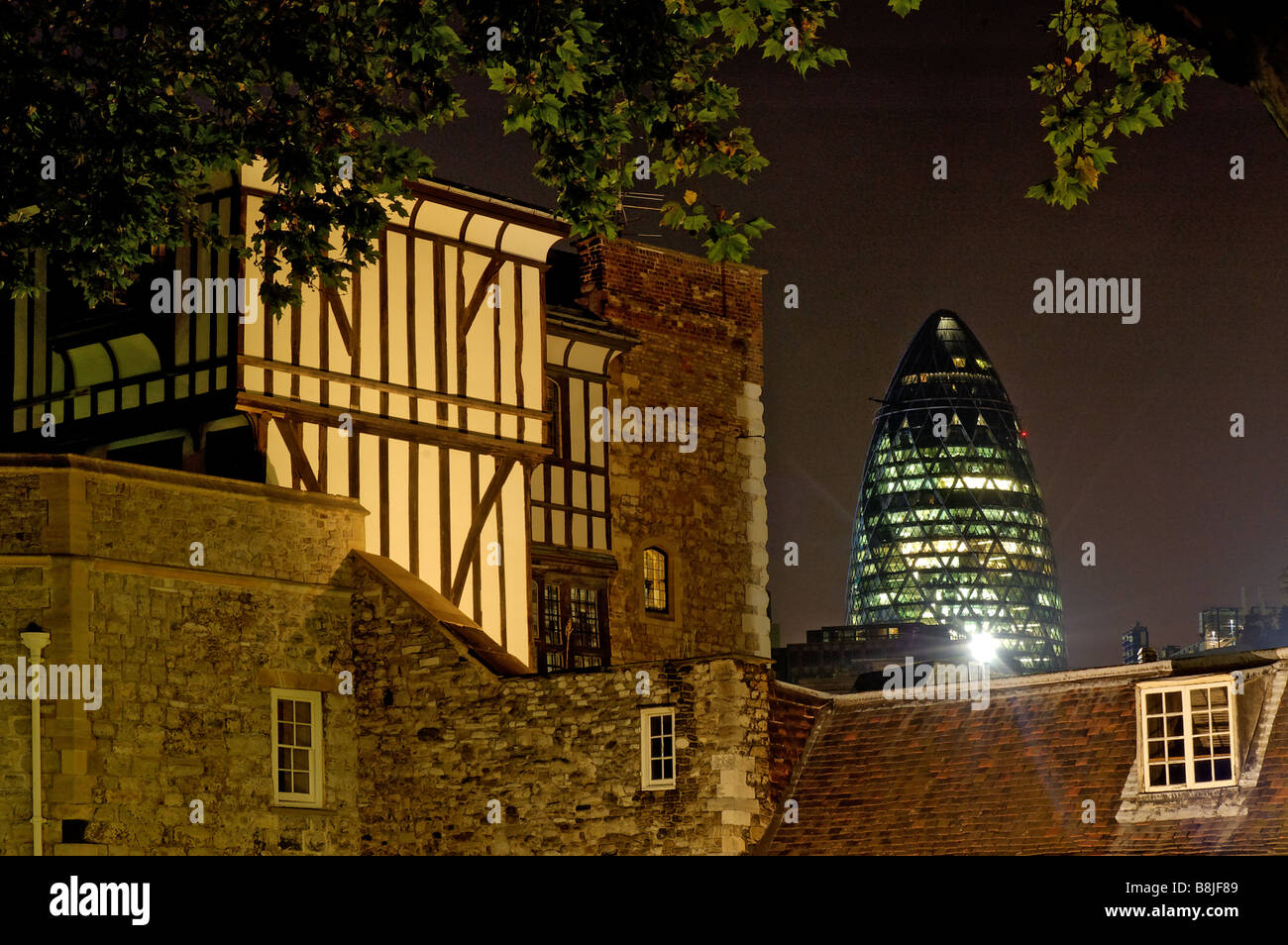 The Tower of London at night with the Gherkin behind Stock Photo - Alamy