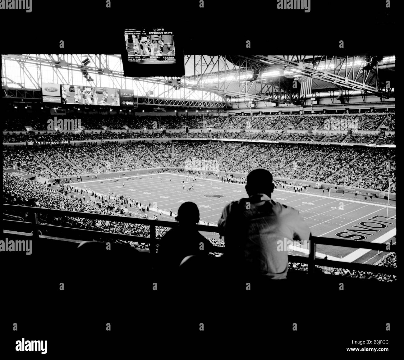 A father and son watching the NFL team the Detroit Lions play at Ford ...
