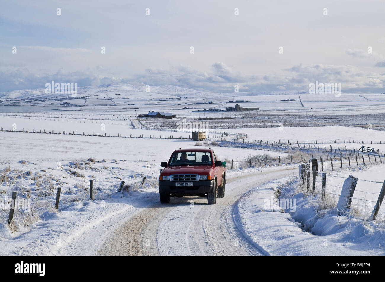 dh ROADS UK Farmers truck on icy snow roads car driving rural scotland ...