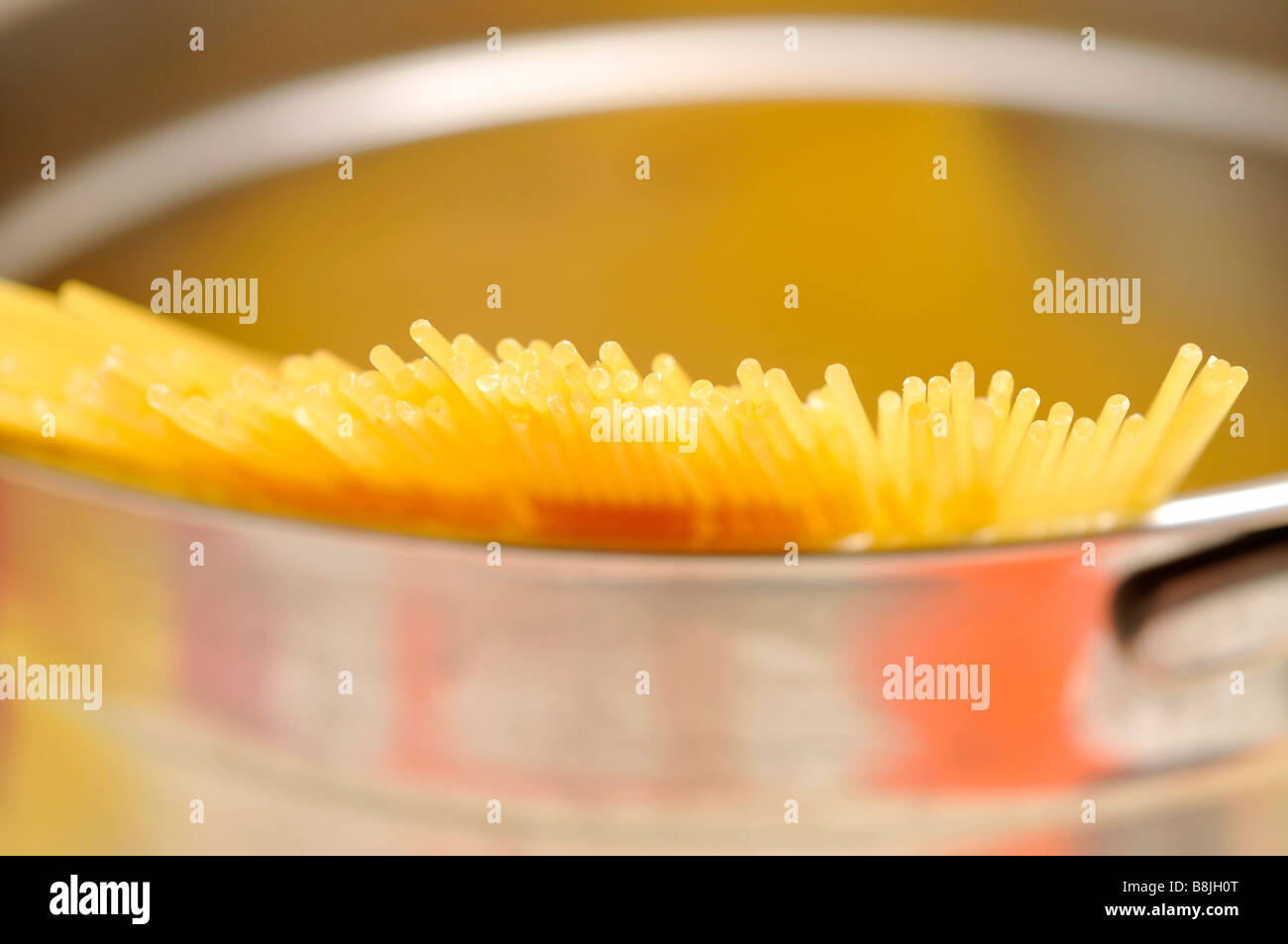 dried spaghetti in stainless steel pan uncooked raw water italian food ...