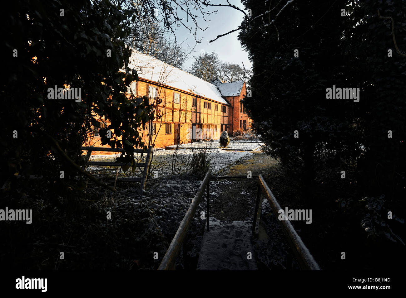 converted mill buildings in a village covered with snow Stock Photo - Alamy