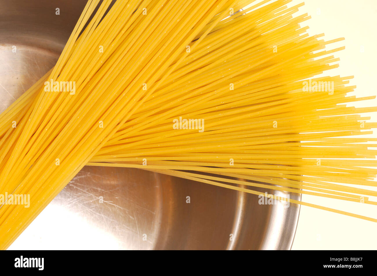 dried spaghetti in stainless steel pan uncooked raw water italian food ...
