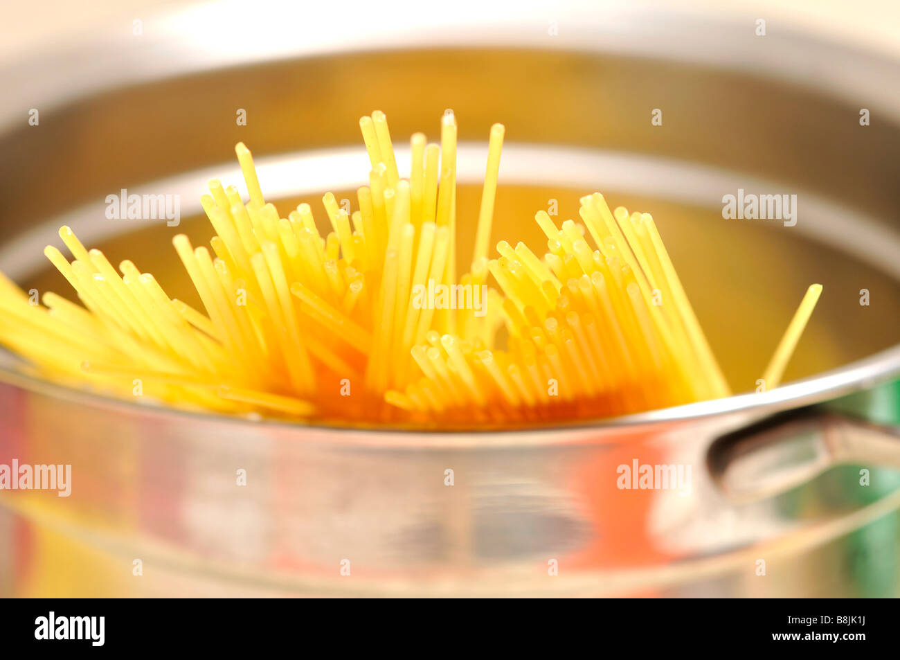 dried spaghetti in stainless steel pan uncooked raw water italian food ...