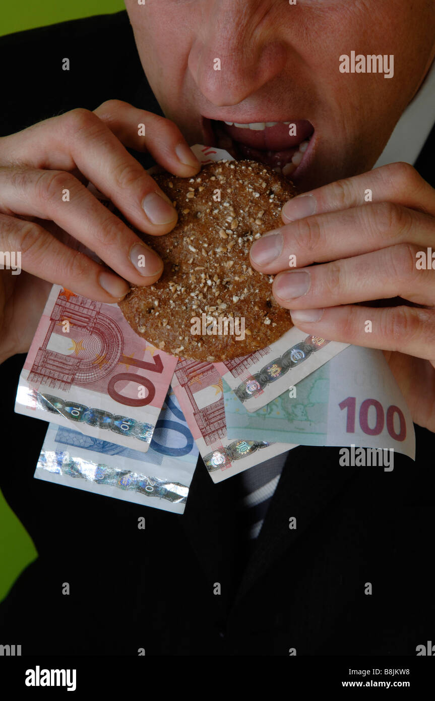 Business man eating a sanwich with bank notes Stock Photo - Alamy