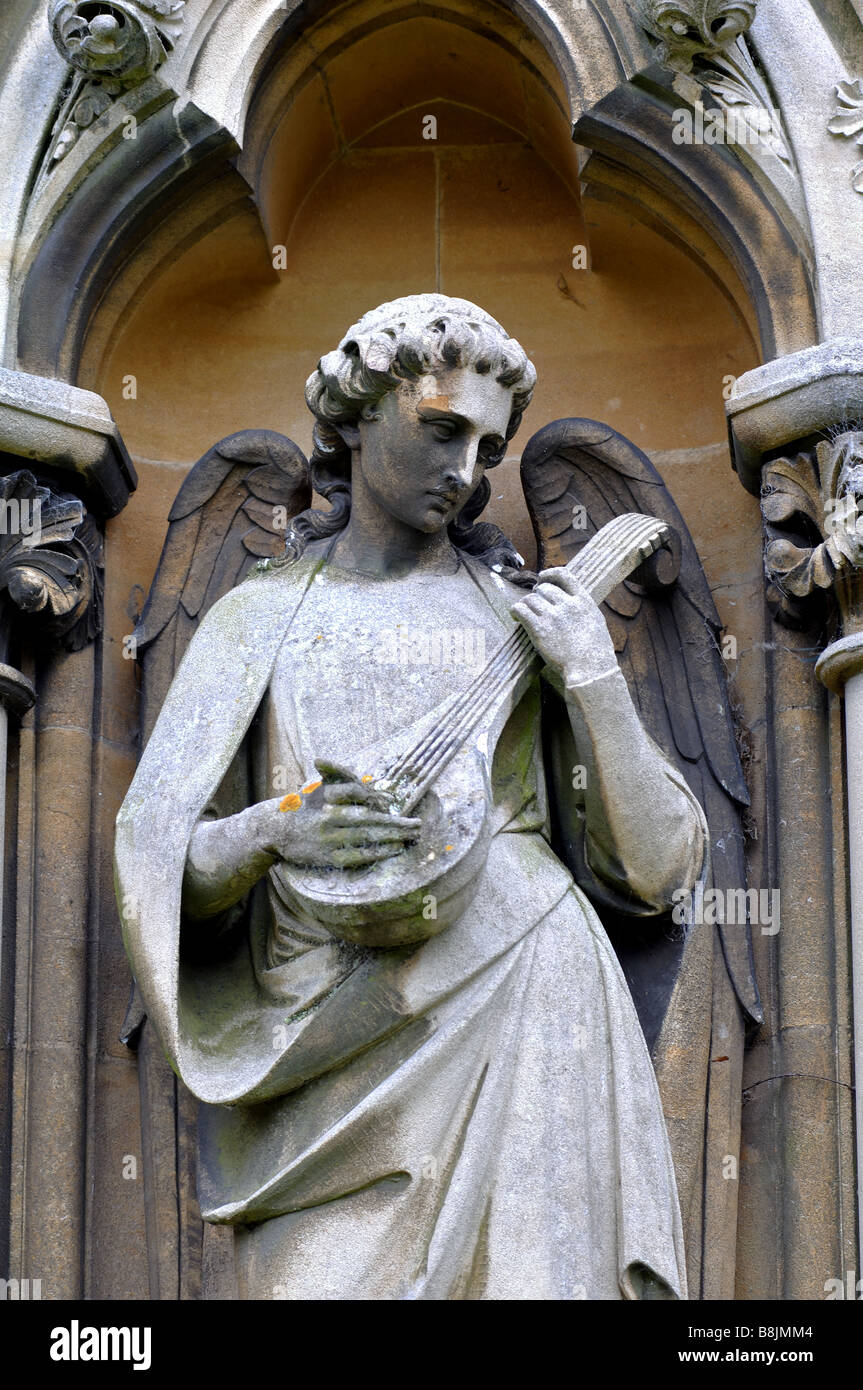 Angel playing musical instrument on All Saints Church, Sherbourne ...