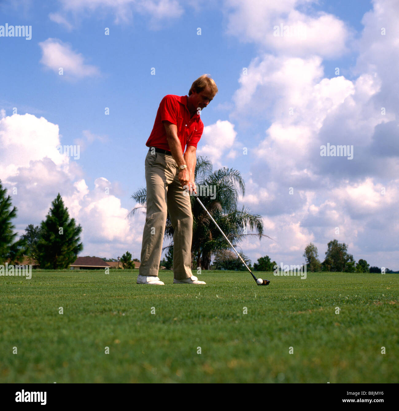 Man playing golf Stock Photo - Alamy