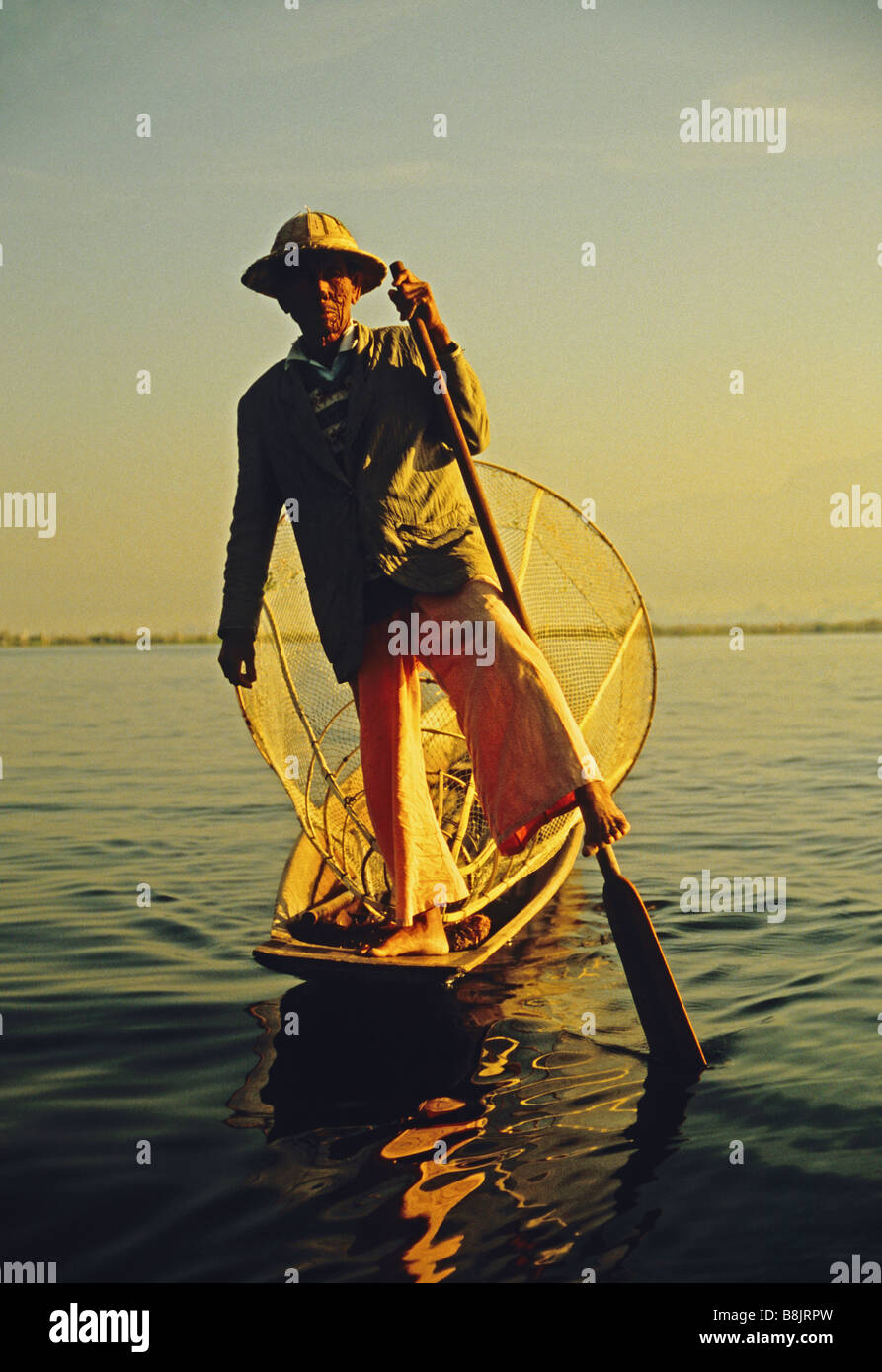 Myanmar's Inle Lake, Intha leg rower with fishing net in boat in late ...