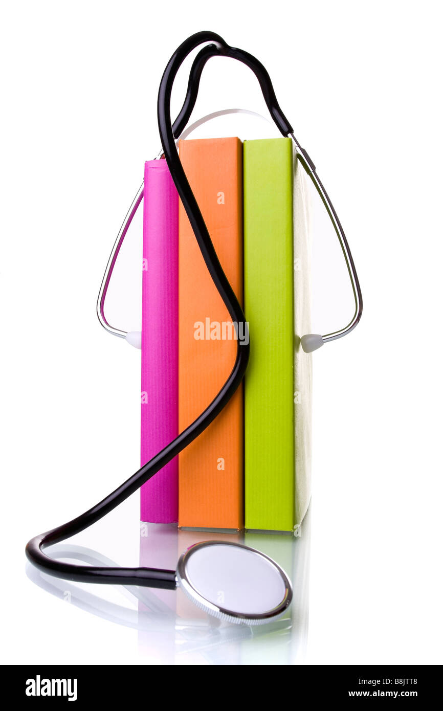 medical equipment and a stack of books isolated on white selective ...