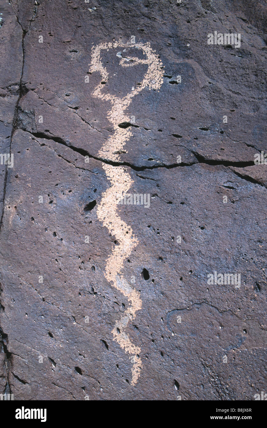 Petroglyph depicting a snake with a a human head in New Mexico USA ...