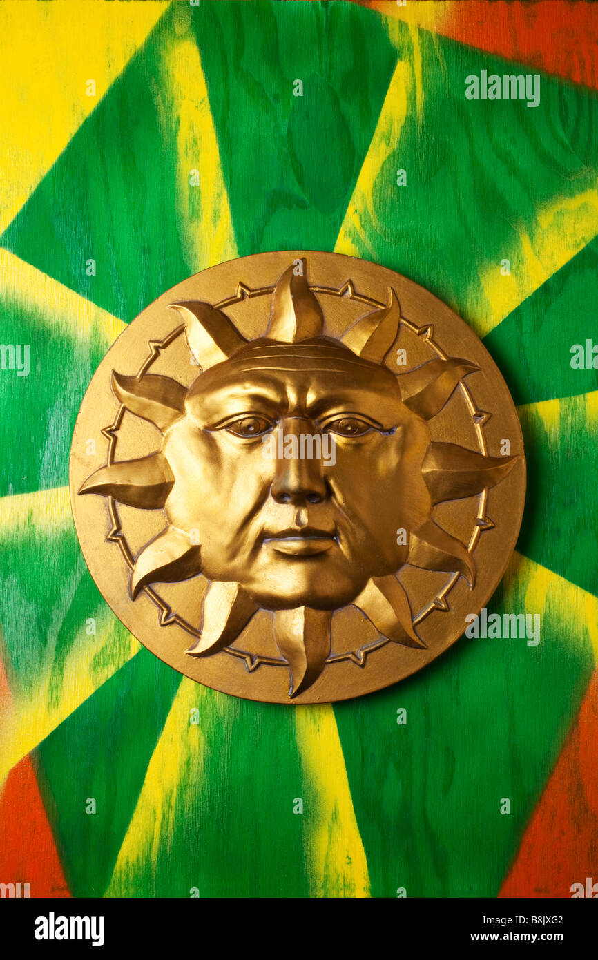 Golden sun face disk Stock Photo - Alamy