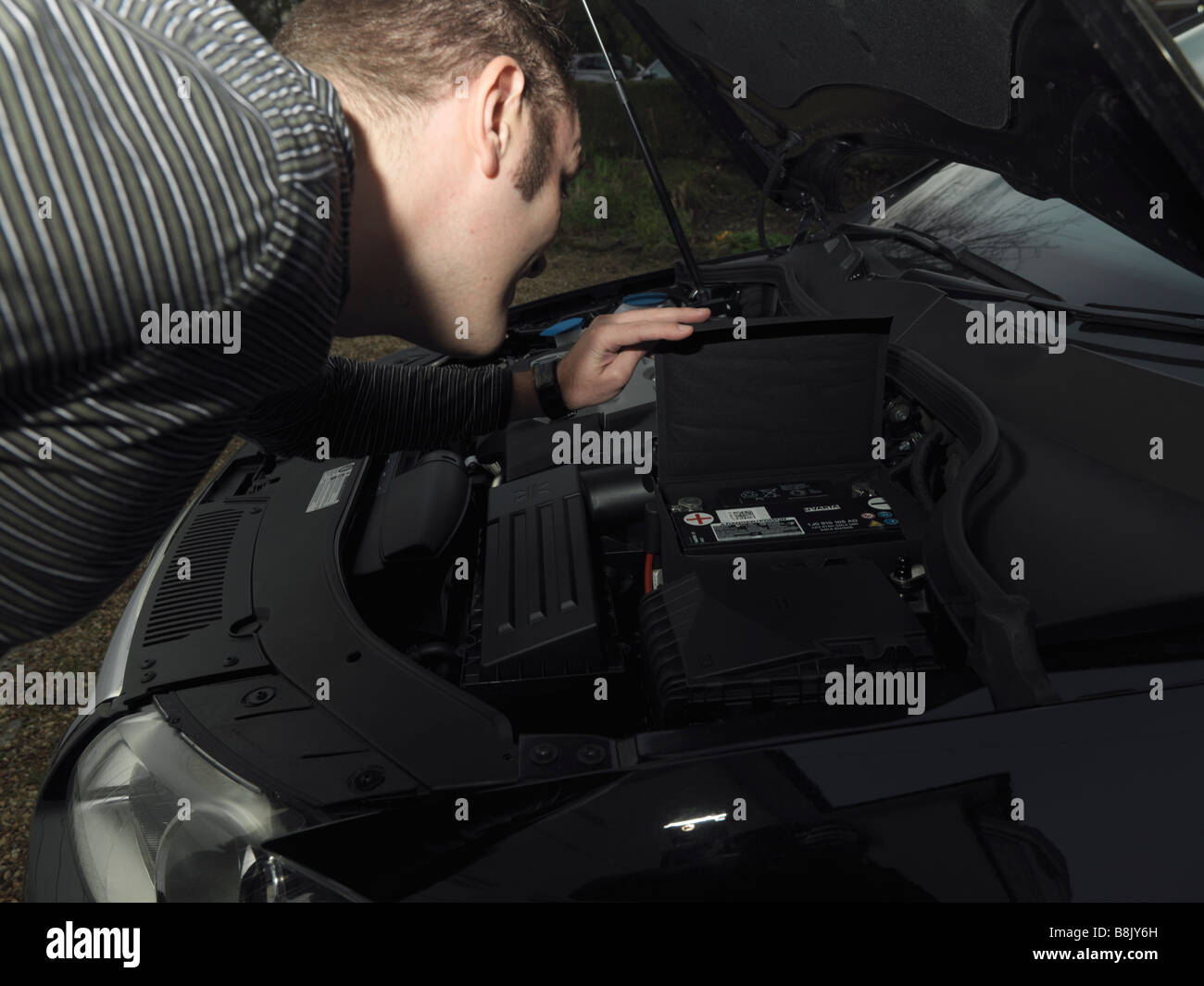Checking Car Battery Stock Photo - Alamy