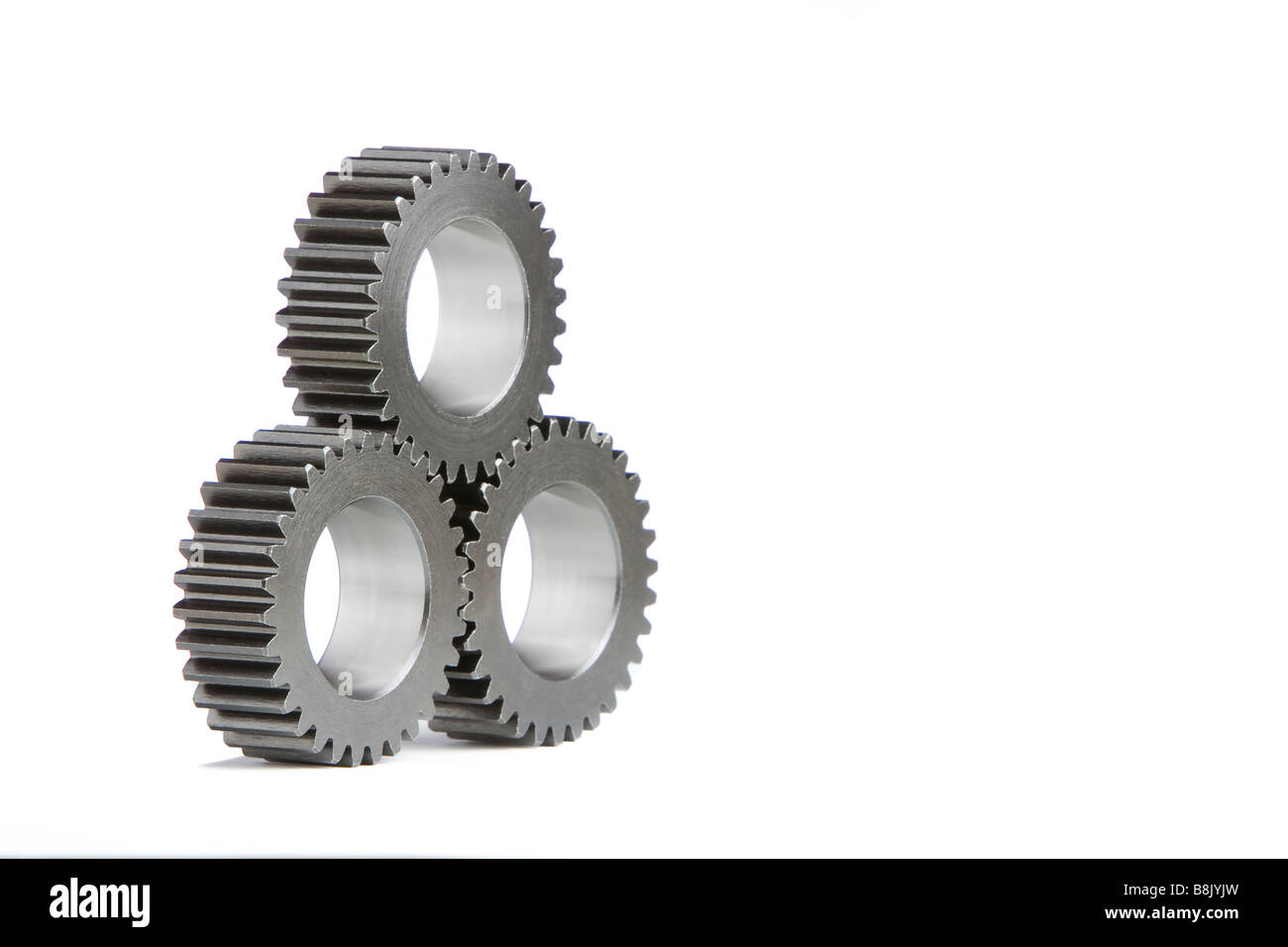 three gears on white background Stock Photo - Alamy
