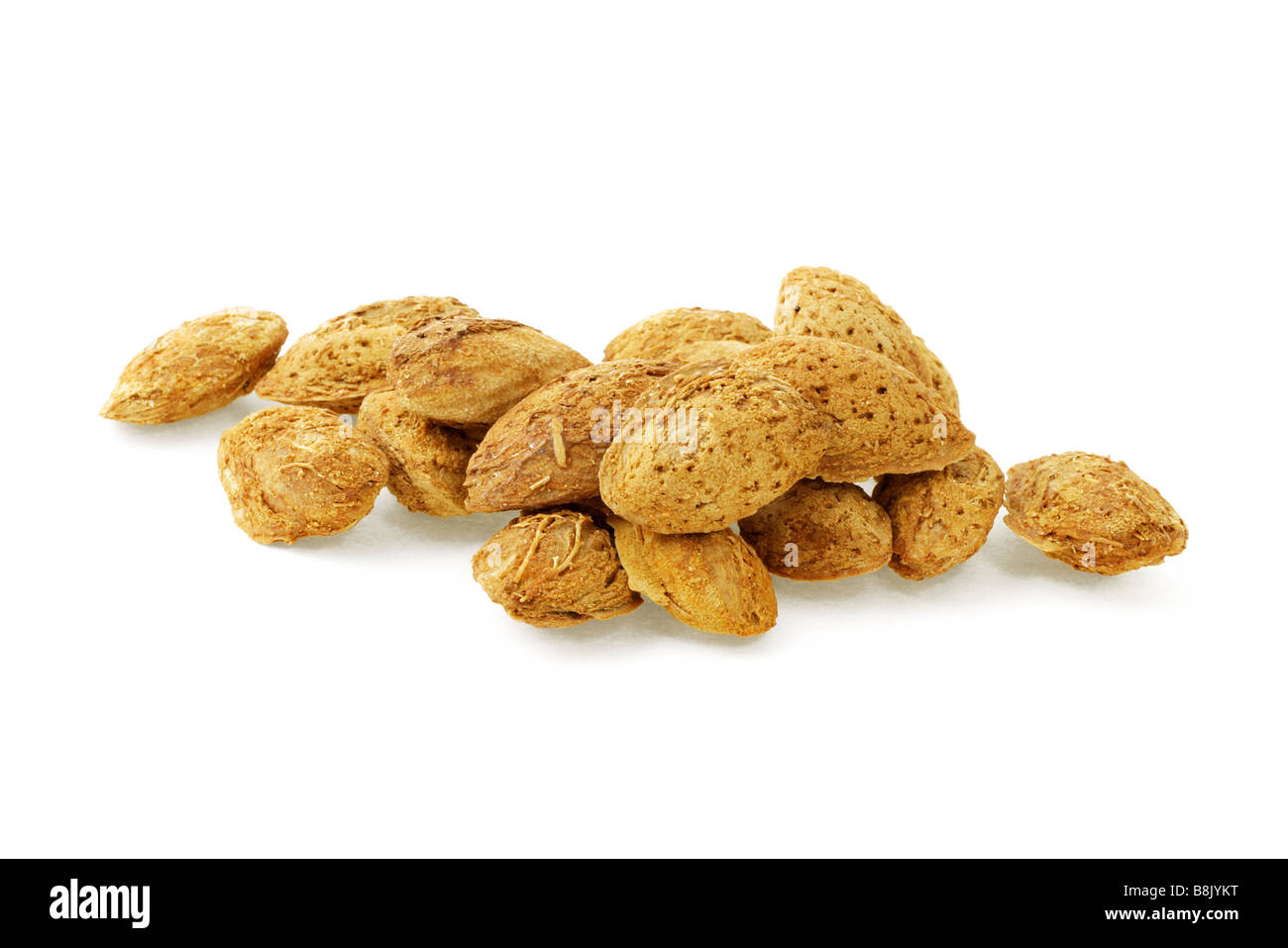 Almond nuts scattered on white background Stock Photo - Alamy