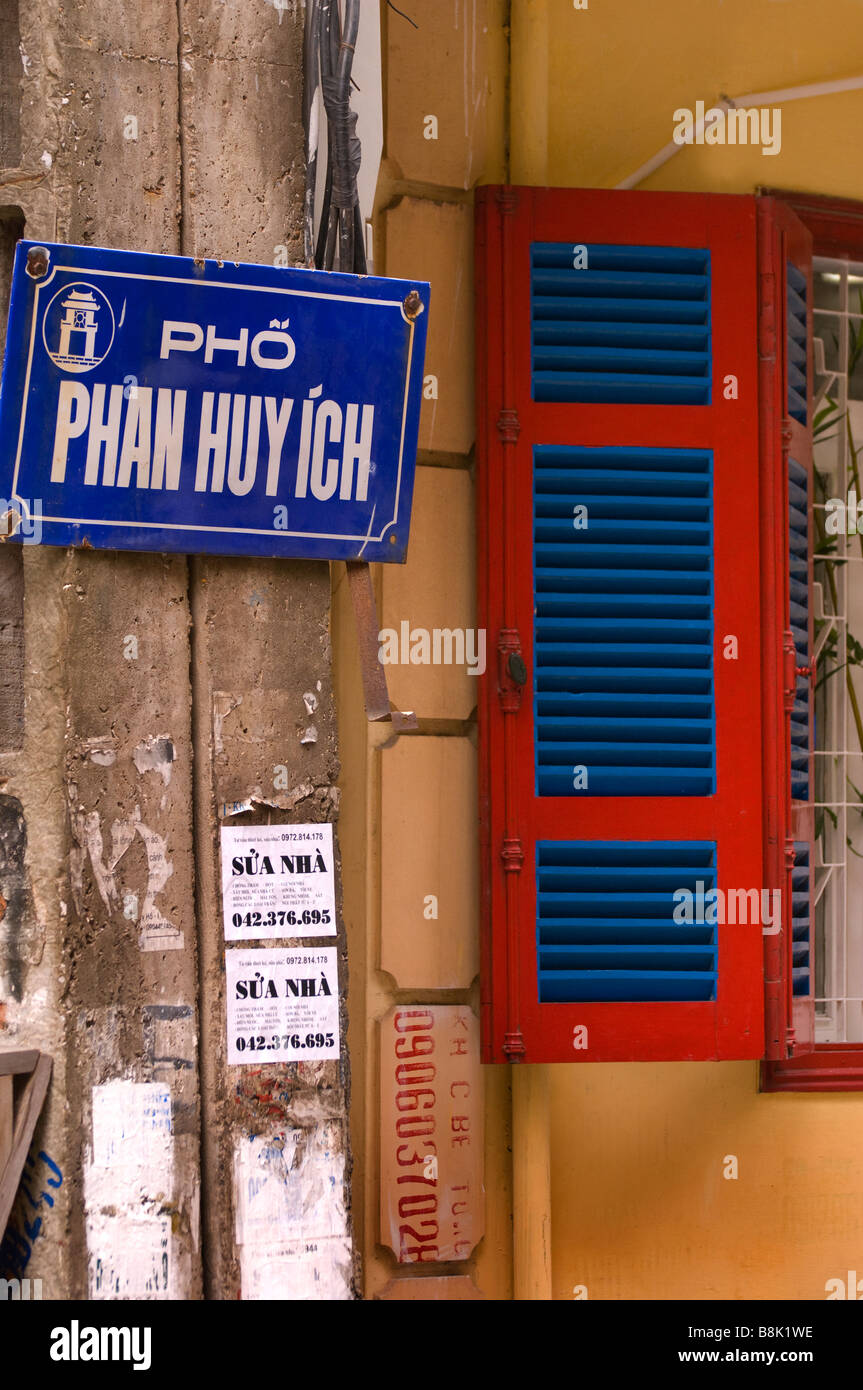 Red and blue shutter with road sign, Hanoi French Quarter, Vietnam ...
