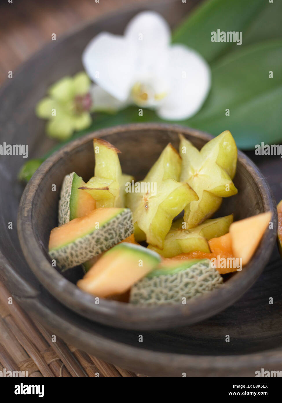 melon,Carambola and orchids Stock Photo - Alamy