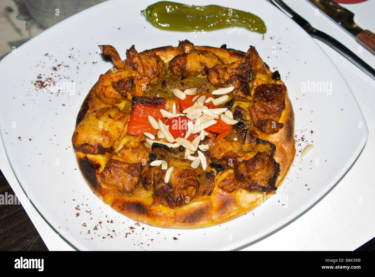 Turkish middle eastern style baked chicken with slivered almonds ...