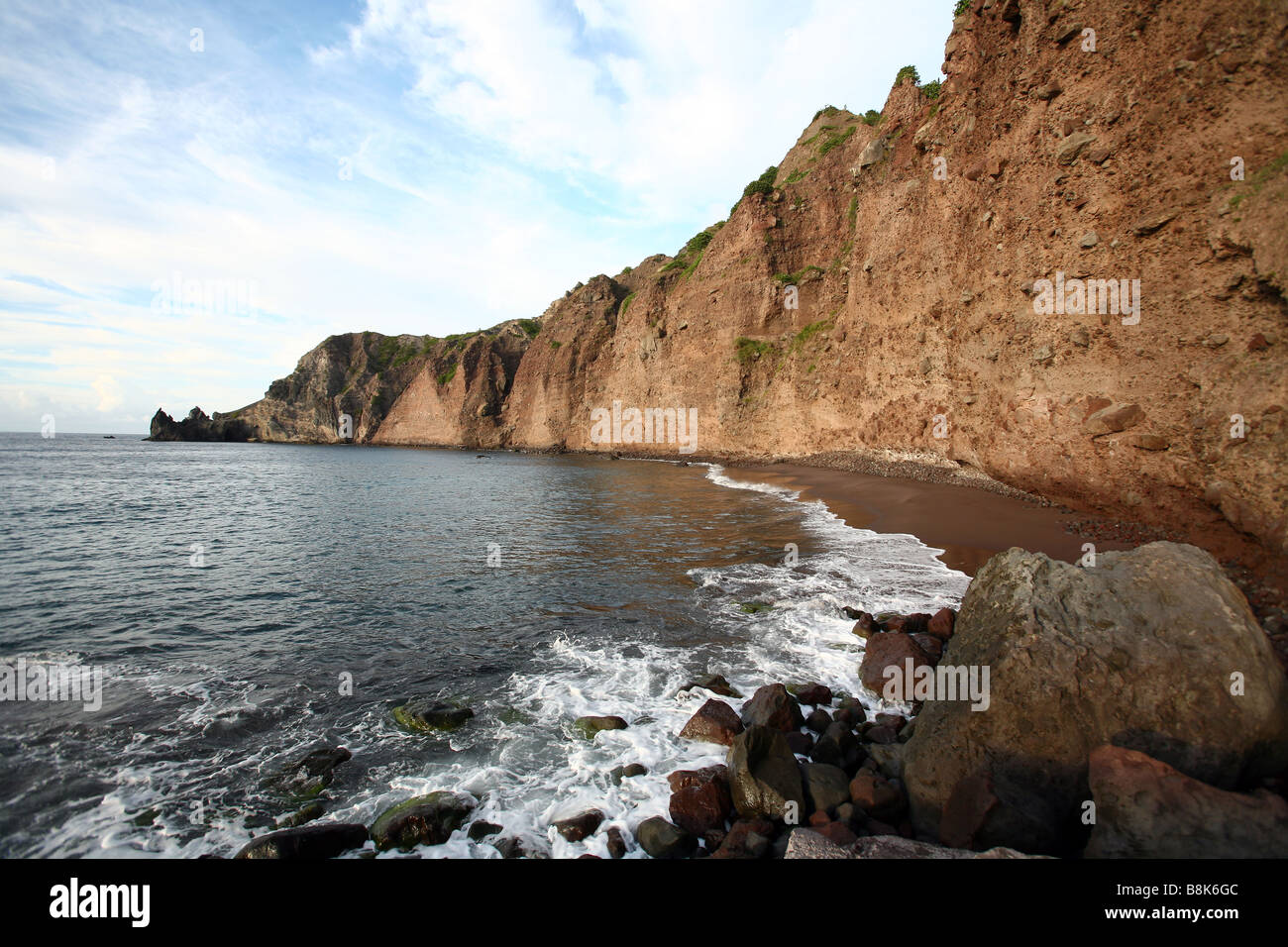View on a volcanic beach with black sand on the Caribbean isle Saba in ...